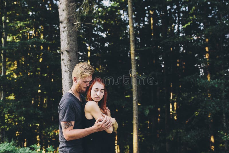 Guy hugging his girlfriend stock photo. Image of park - 76456084