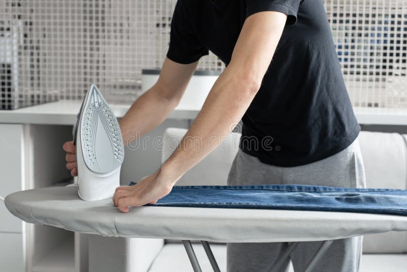A Guy Ironing Clothes before Going Outside Stock Image - Image of ...