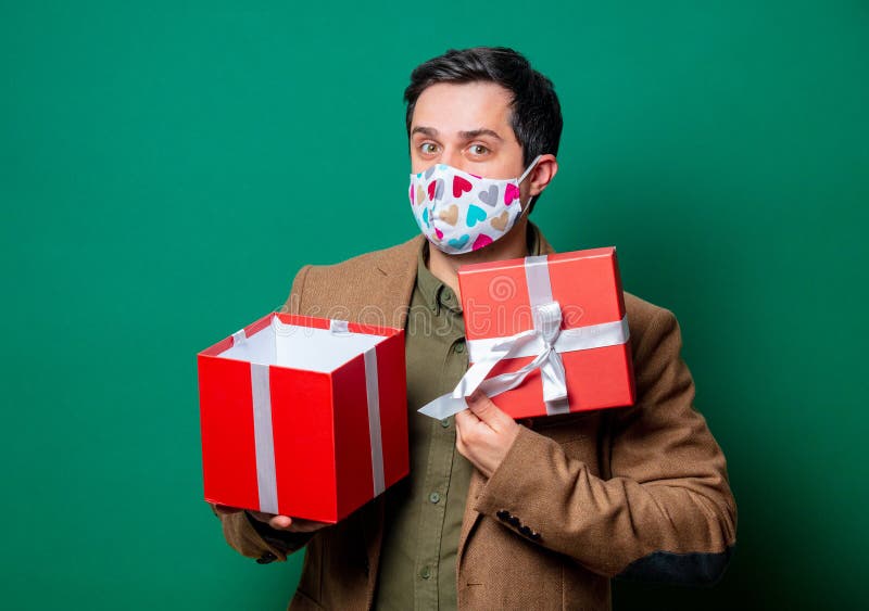 Guy in Jacket and Face Mask Hold Gift Box Stock Image - Image of ...