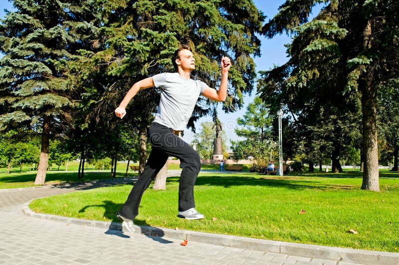 Guy jogging stock image. Image of grass, jogging, hair - 16821293