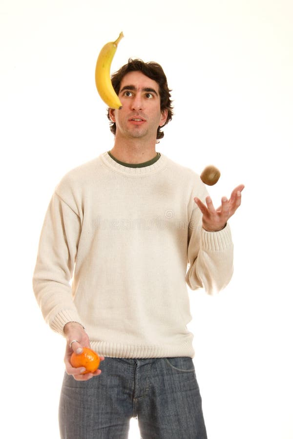 Guy juggling fruit stock photo. Image of play, banana - 18002150