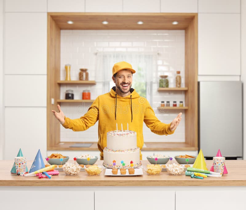 Guy in a Kitchen Standing Behind a Counter with Cake Stock Image ...
