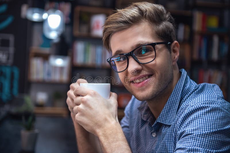 Guy in the library stock photo. Image of library, drink - 291238596