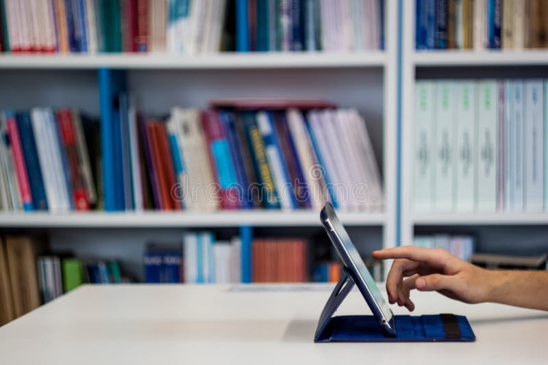 Guy in the Library Working on a Laptop Stock Image - Image of library ...