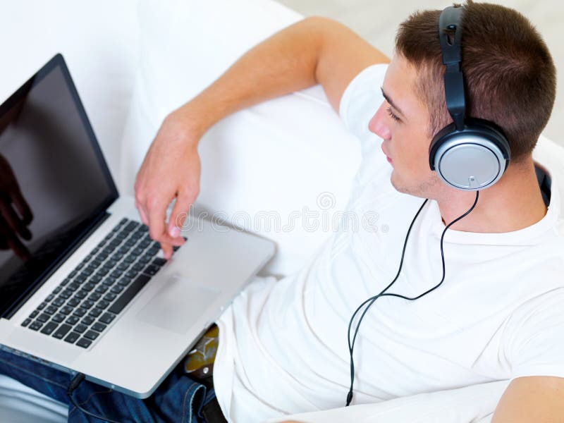 Guy Listening Music in Headphone from Laptop Stock Photo - Image of ...