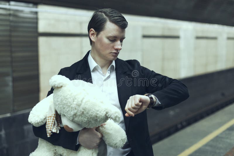 Guy is Looking at His Watch. Stock Image - Image of embrace, friend ...