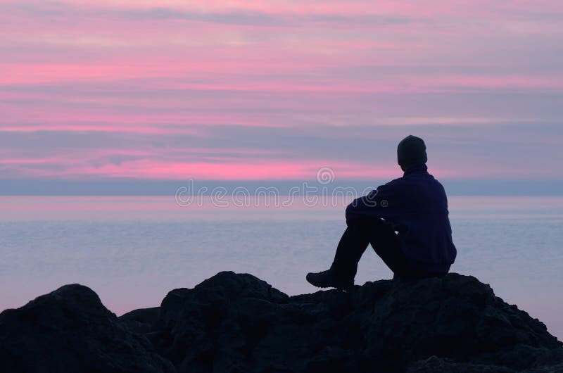 Guy looks at the sunset stock image. Image of meditate - 39014647