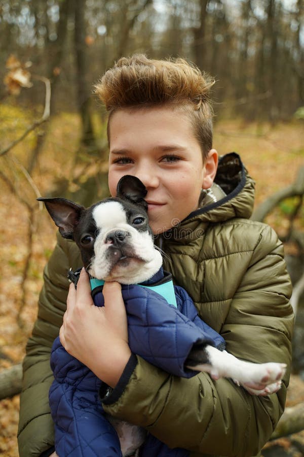 A Guy Lovingly Hugs His Dog. Stock Photo - Image of friendship, smile ...