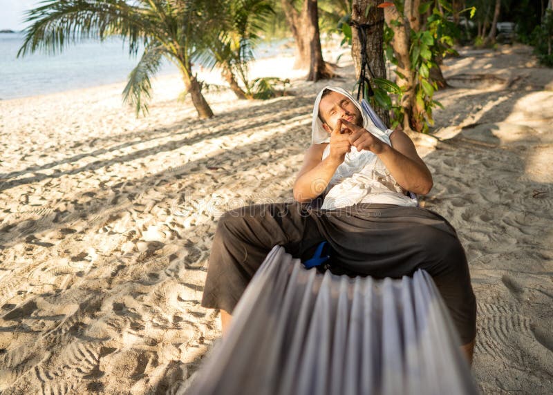 Guy is Lying on a Hammock Near the Sea in the Jungle Stock Image ...