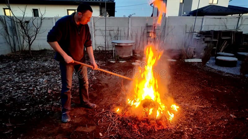 A Guy Makes Fire Outside Ash Danger Stock Footage - Video of flaming ...