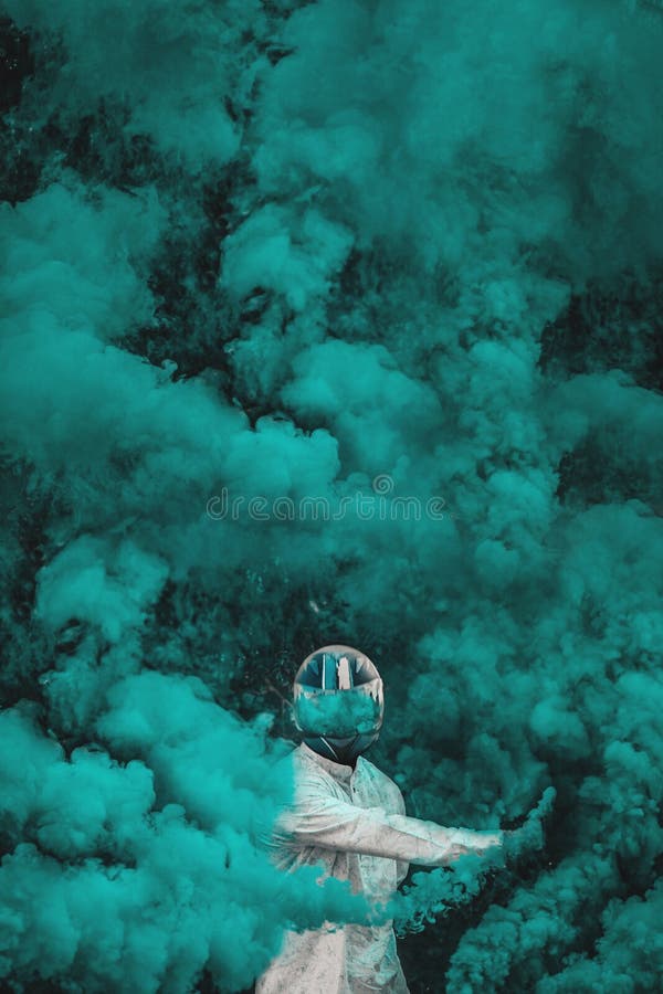 Guy in Mask Standing in between Blue Smoke Bombs. Vertical Stock Image ...