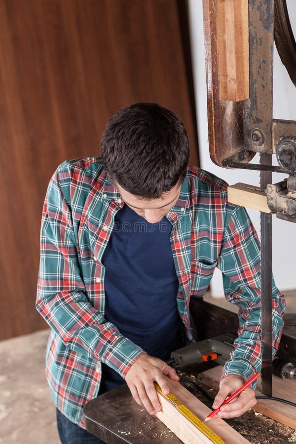Guy Measuring a Piece of Wood Stock Image - Image of careful, rules ...