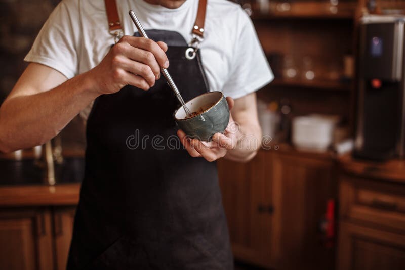 A Guy is Mixing the Coffee in the Cup Stock Photo - Image of kitchen ...