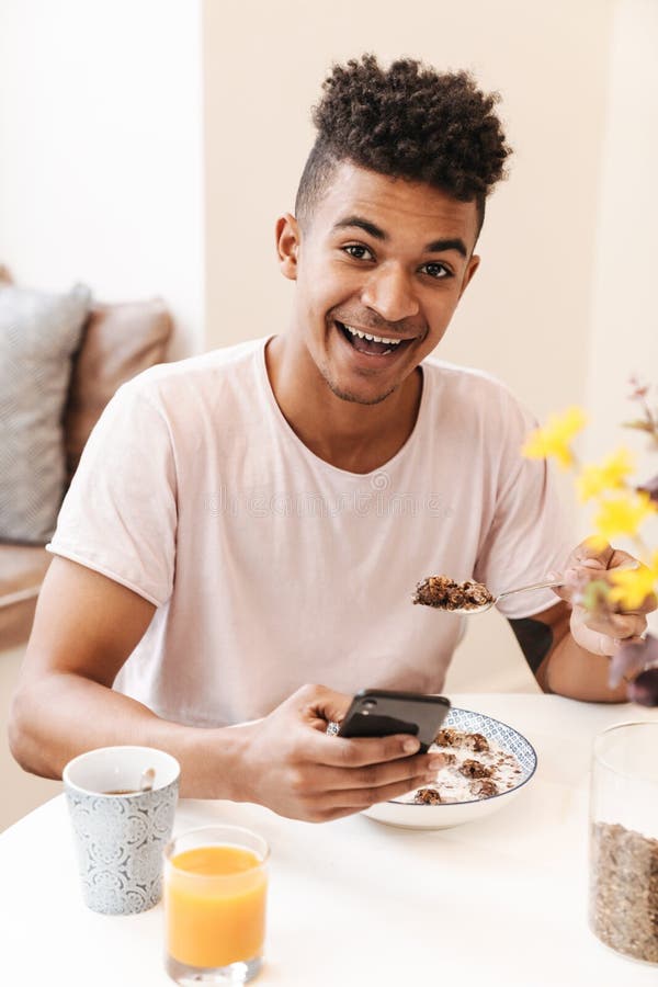 Guy in the Morning Have a Breakfast Using Mobile Phone Stock Photo ...