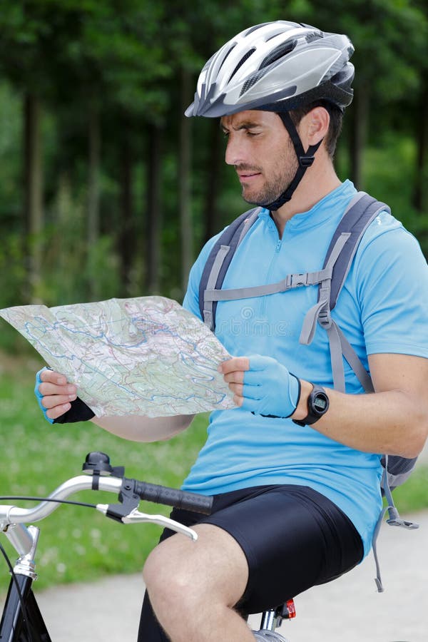 Guy on Mountain Bike Looking at Map Stock Photo - Image of sport ...