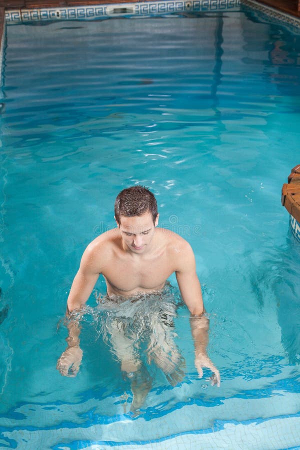 Guy out of the pool stock image. Image of aerobics, person - 65088495