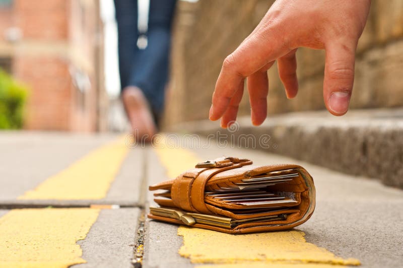 Guy Picking Up a Lost a Lost Purse/wallet Stock Image - Image of ...