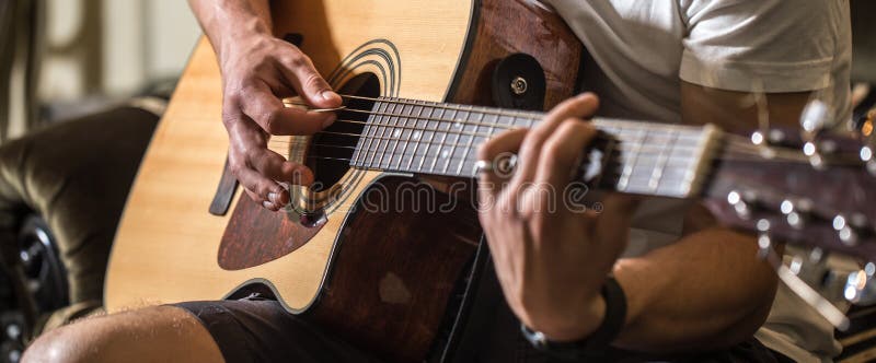 The Guy Playing the Acoustic Guitar Stock Photo - Image of holding ...