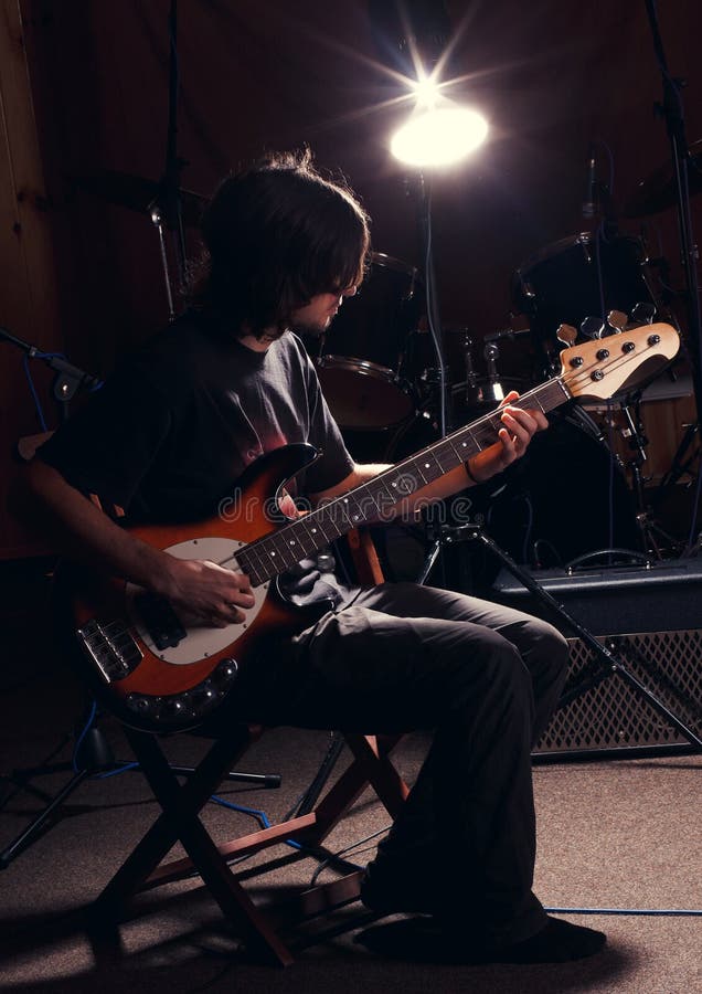 Guy playing bass guitar stock image. Image of black, attractive - 66627437