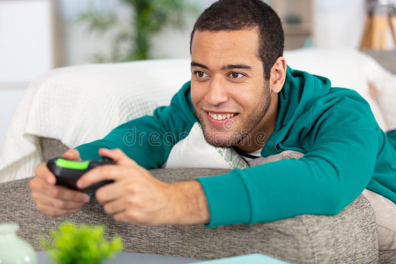Guy playing on console stock photo. Image of television - 326323084