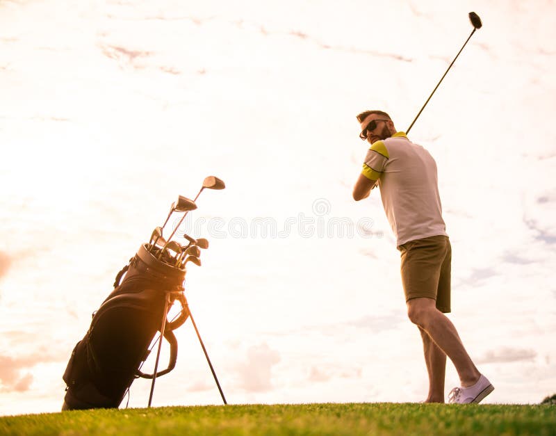 Guy playing golf stock photo. Image of healthy, male - 100038702