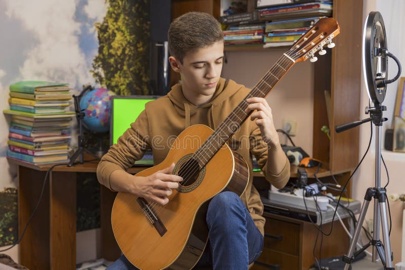 Guy playing guitar stock photo. Image of inside, instrument - 241127508