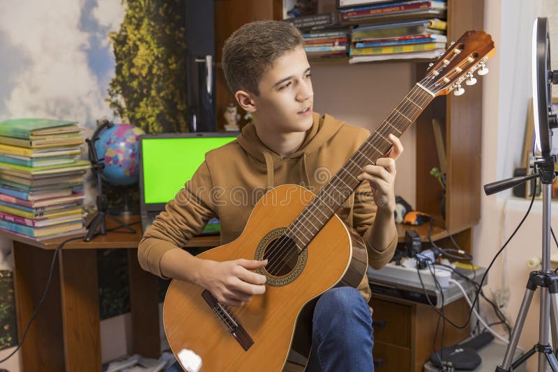 Guy playing guitar stock image. Image of musician, music - 245392775