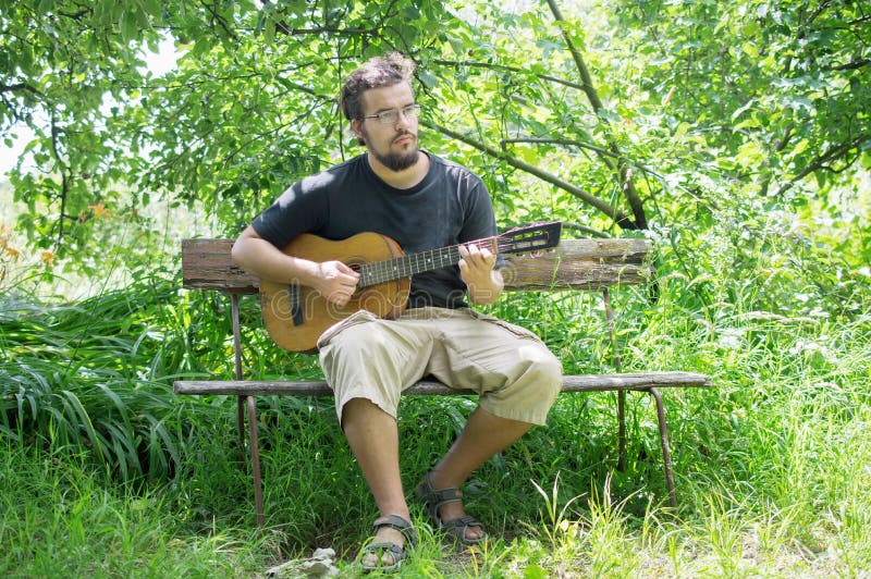 Guy playing guitar stock image. Image of instrument, male - 57041033