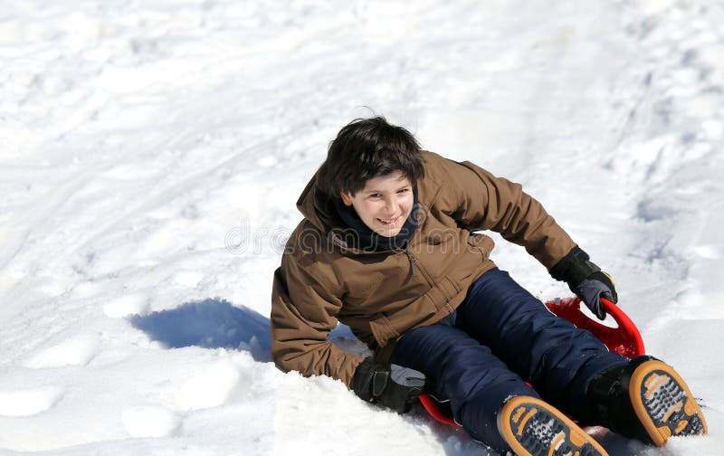 Guy Plays with Sledding on Snow Stock Image - Image of cheerful ...