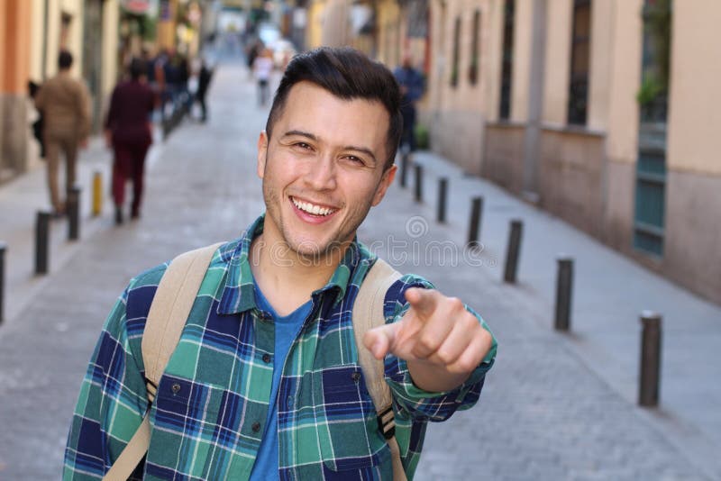 Guy Pointing with a Finger and Smiling Stock Photo - Image of latino ...