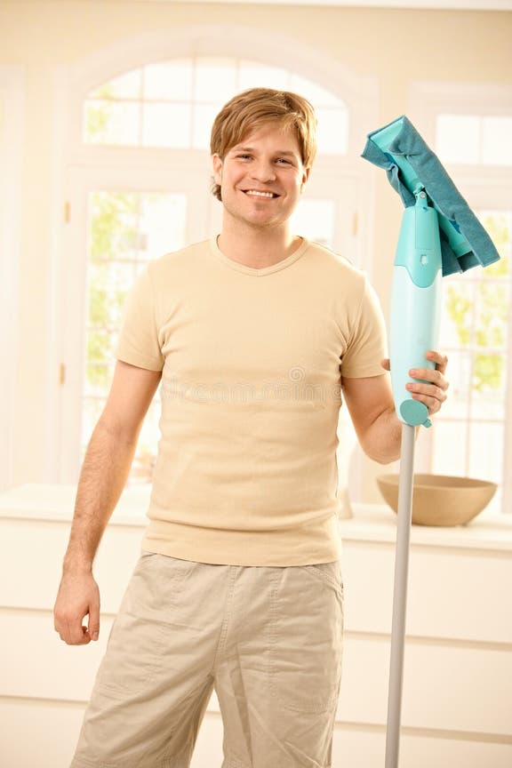 Guy posing with mop stock image. Image of contact, blue - 16418745