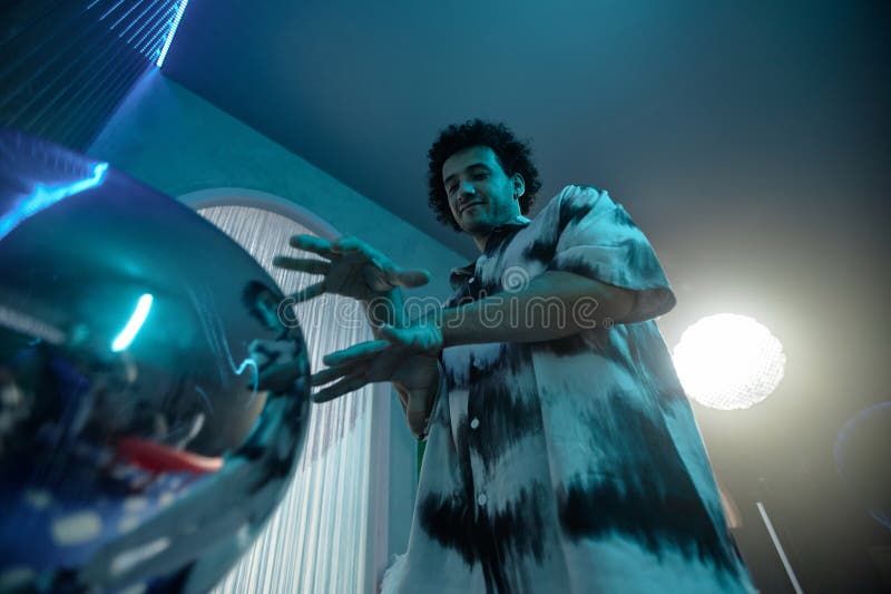 Guy Posing Next To Art Object in Modern Creative Space Stock Photo ...