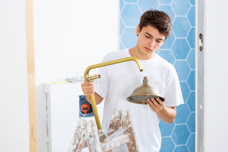 Guy Preparing New Shower for Installation in Building Under ...