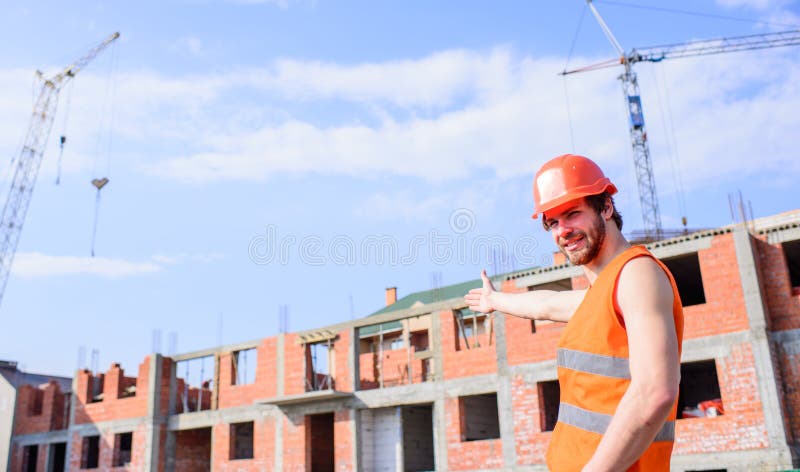 Control Construction Process. Builder in Working Clothes and Helmet ...