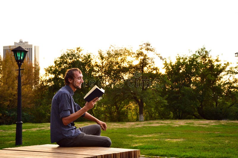 Guy reading book stock image. Image of blue, city, model - 59422029