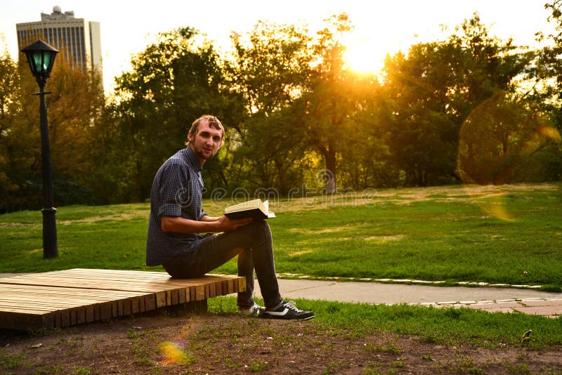 Guy reading book stock image. Image of blue, novel, people - 59422969
