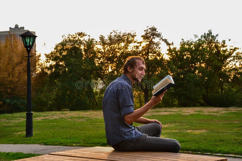 Guy reading book stock photo. Image of poem, novel, male - 59423030