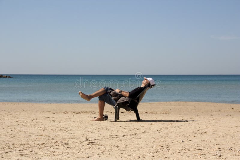 Guy Relaxing in a Chair on the Beach Editorial Image - Image of lounger ...