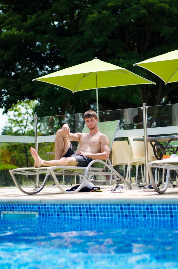 The Guy is Resting on a Sun Lounger Stock Photo - Image of resort ...