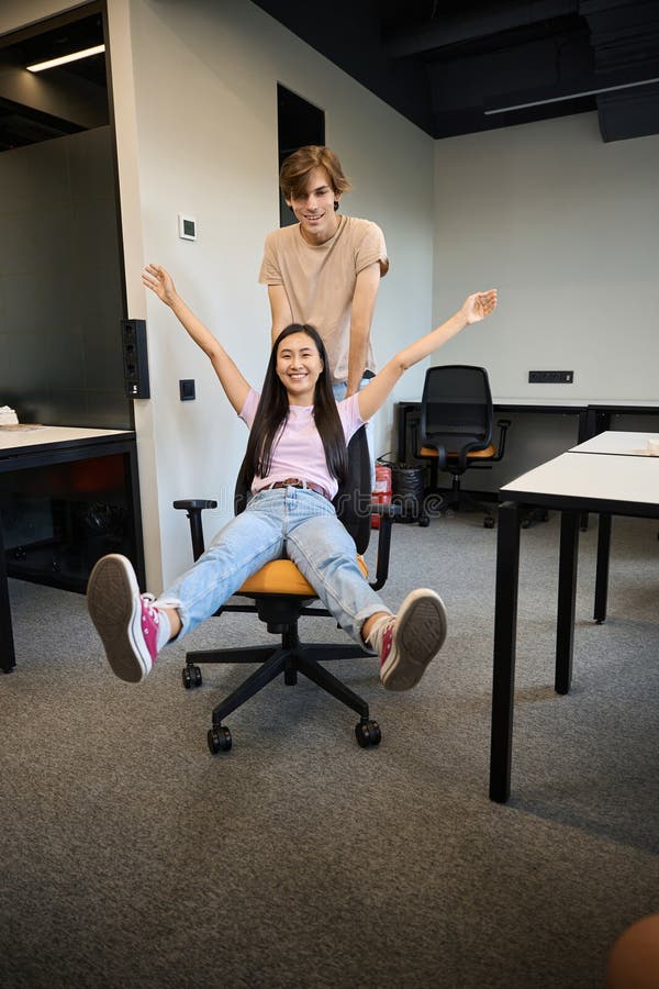 Guy Rides His Girlfriend in the Office Chair Stock Image - Image of ...