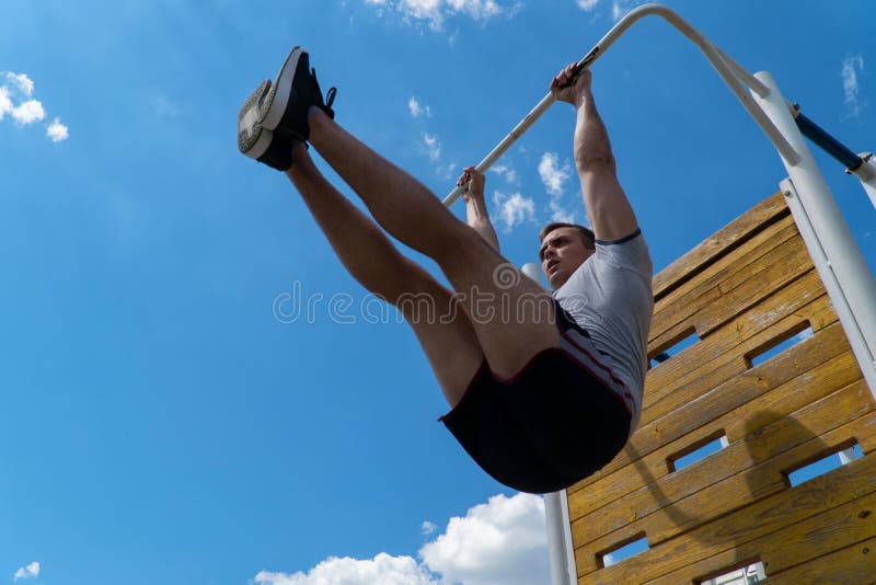 The Guy is Rocking the Press on the Horizontal Bar. Workout Outdoors ...
