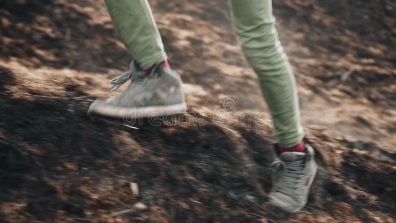 The Guy Runs through the Burned Grass. Ash and Dust Fly from Under Your ...