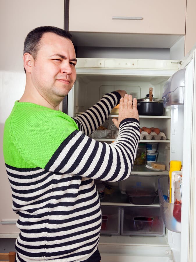 Guy Searching for Something in Refrigerator Stock Photo - Image of ...