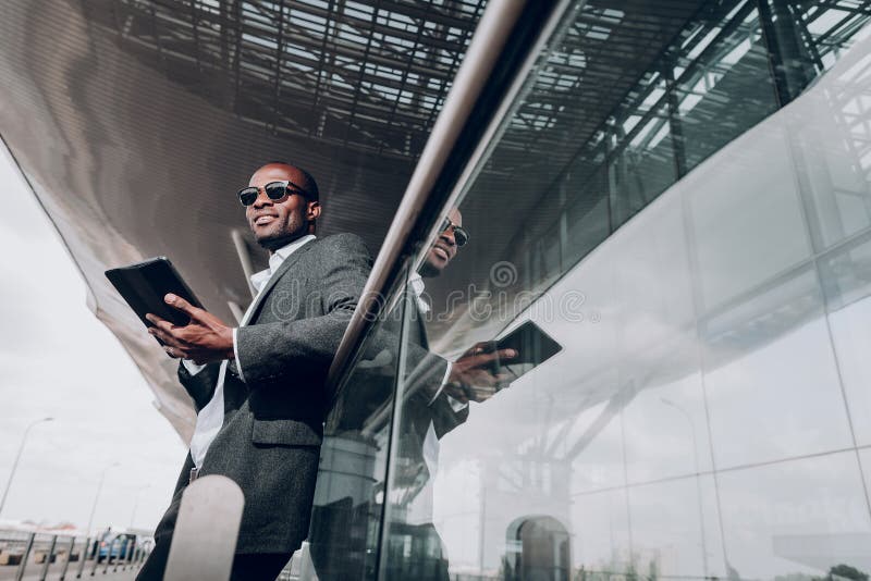 Guy Searching Web at the Airport Using Tablet Stock Photo - Image of ...