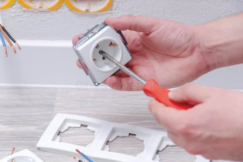 The Guy Sets the Sockets in the Room. Repair in the House Stock Image ...