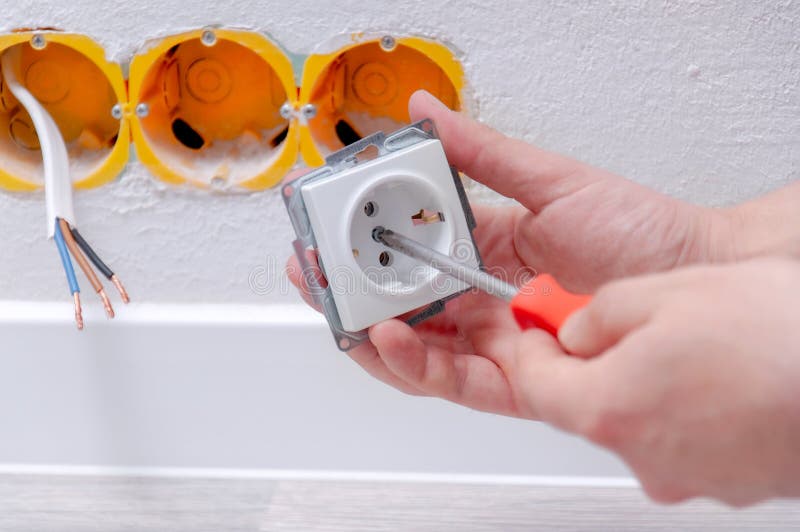 The Guy Sets the Sockets in the Room. Repair in the House Stock Photo ...