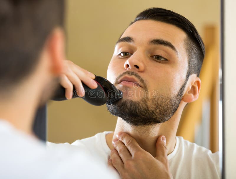 Guy Shaving by Electric Shaver Stock Photo - Image of ordinary, eyebrow ...