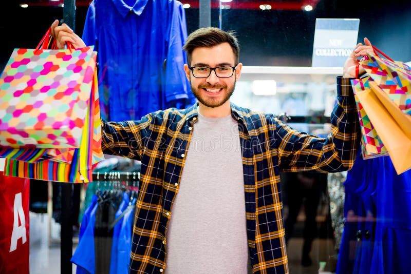 Guy shopping in a mall stock photo. Image of people, looking - 94454274