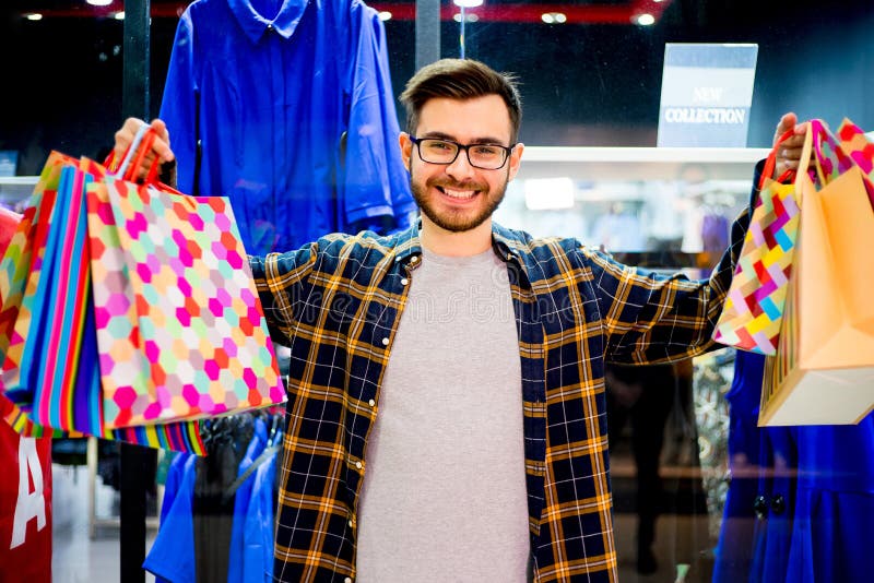 Guy shopping in a mall stock photo. Image of casual, cheerful - 94454382