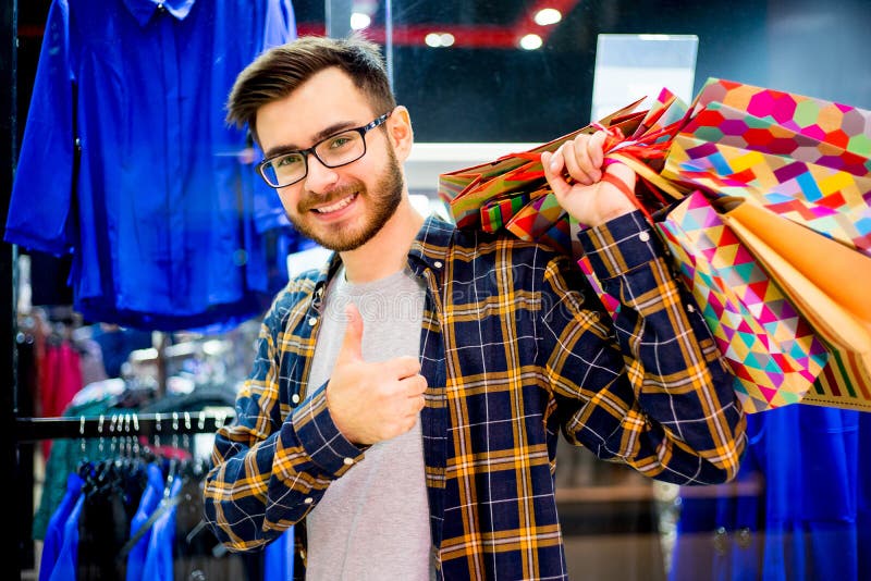 Guy shopping in a mall stock photo. Image of friendly - 94454462